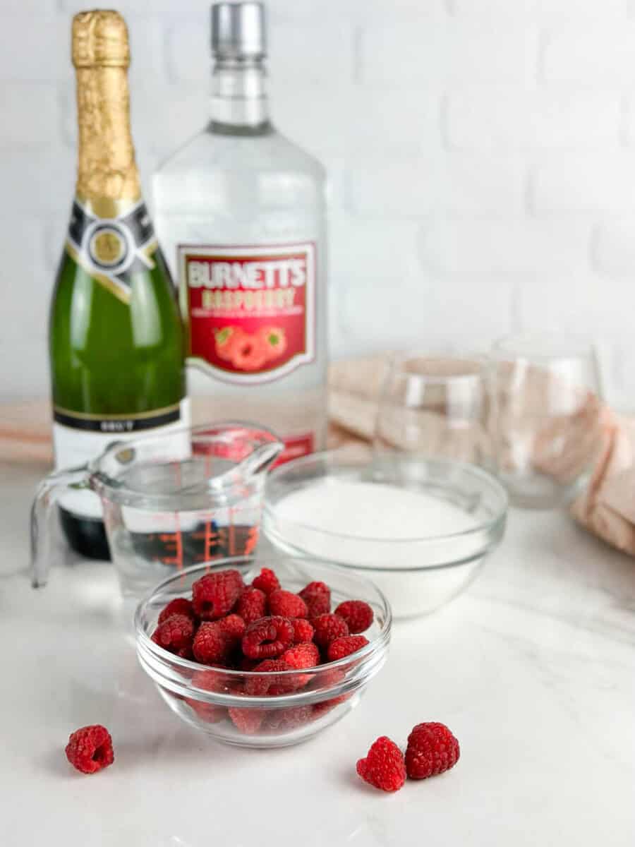 Sweet Sparkly Raspberry Champagne Cocktails - Seasoned Sprinkles